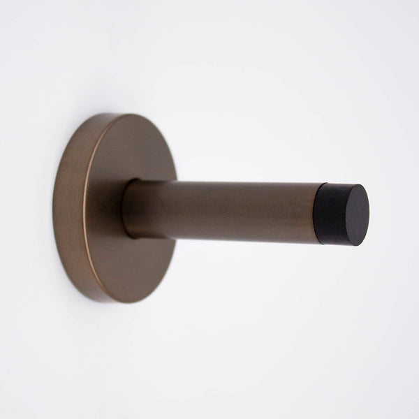 Aged Brass Wall Mounted Straight Door Stop - Manovella